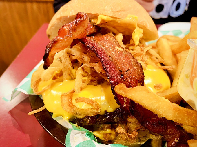 Cheese eruption in progress! This Roadhouse burger doesn't just satisfy hunger—it creates memories with every molten, messy, magnificent bite.