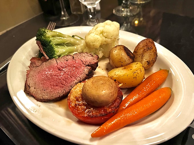 A perfectly cooked slice of heaven surrounded by vegetables that didn't just show up for decoration. This plate means business.