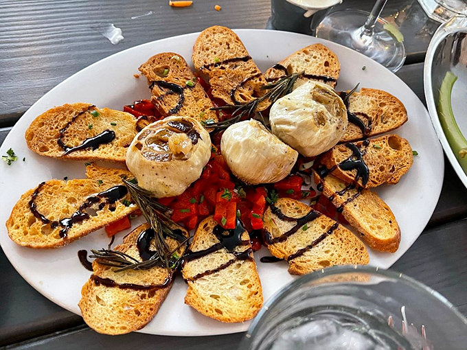 Roasted garlic and crusty bread—the appetizer equivalent of a warm-up act that threatens to steal the whole show.