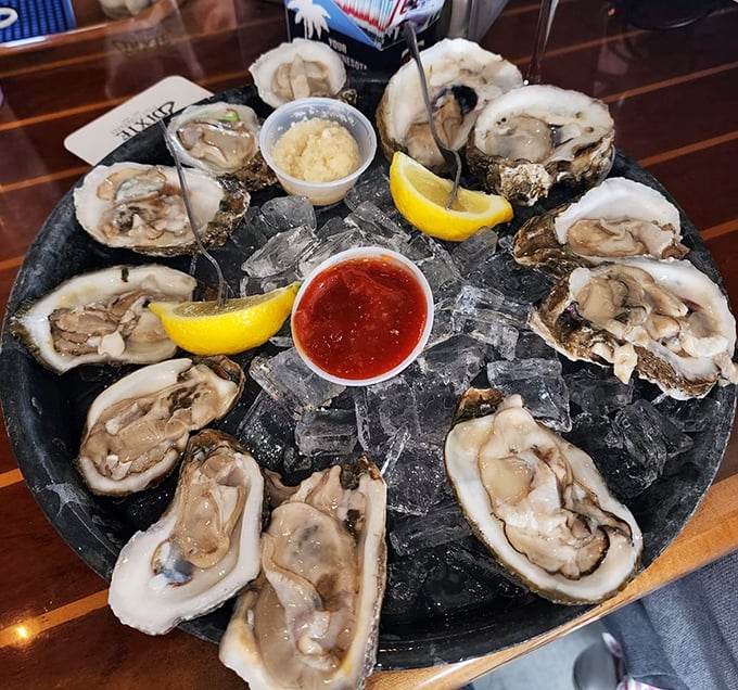 Ocean treasures on ice. These plump oysters, served with lemon and classic accompaniments, are nature's perfect appetizer—briny, fresh, and unapologetically coastal.