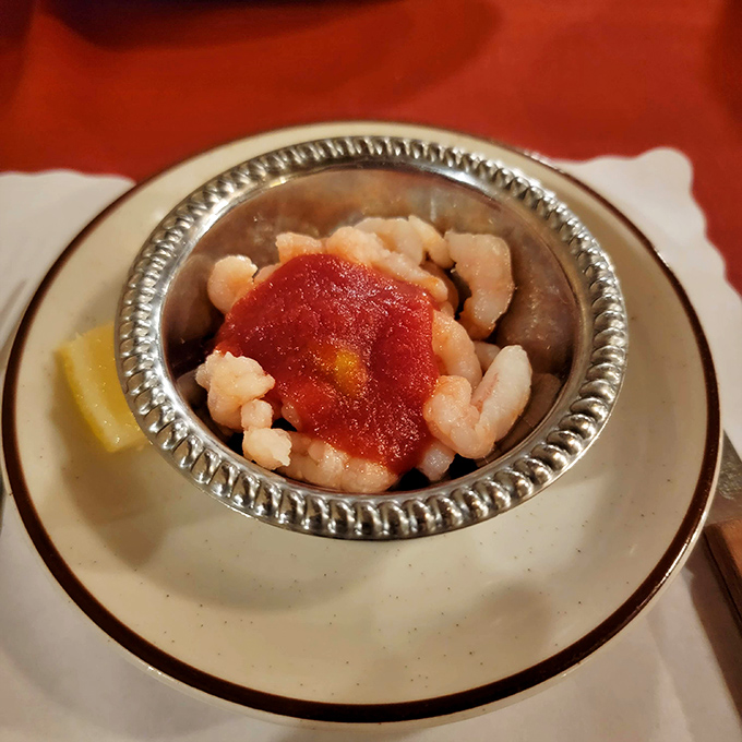 A silver chalice of tender shrimp crowned with cocktail sauce—seafood royalty that somehow feels right at home in barbecue country.
