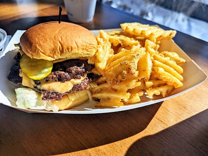 The Smash'd Mac arrives with waffle fries standing at attention like crispy golden soldiers. This isn't just comfort food—it's comfort food that gives you a warm hug.