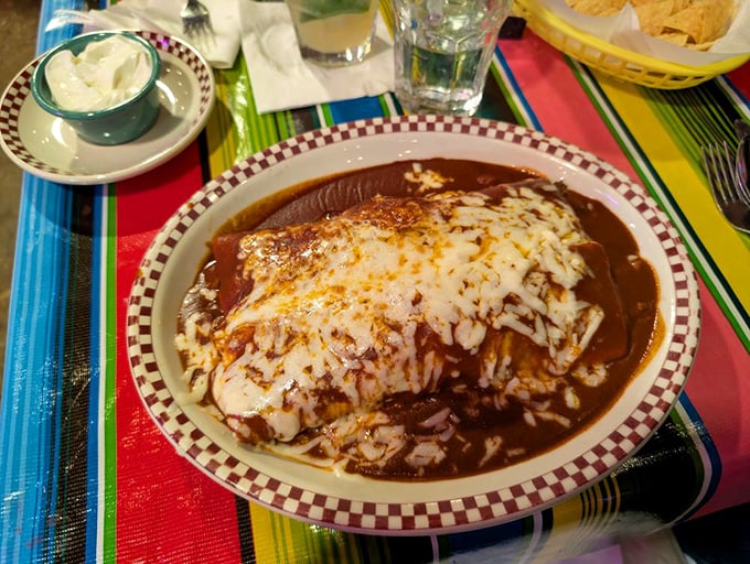 These enchiladas aren't just covered in mole—they're embraced by it, a warm chocolate-hued blanket of complex flavors that dance across your palate.