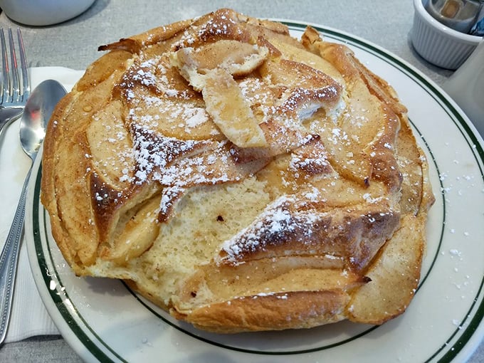 Not all heroes wear capes; some come as souffle pancakes dusted with powdered sugar and topped with caramelized apples. Fork required, restraint optional.