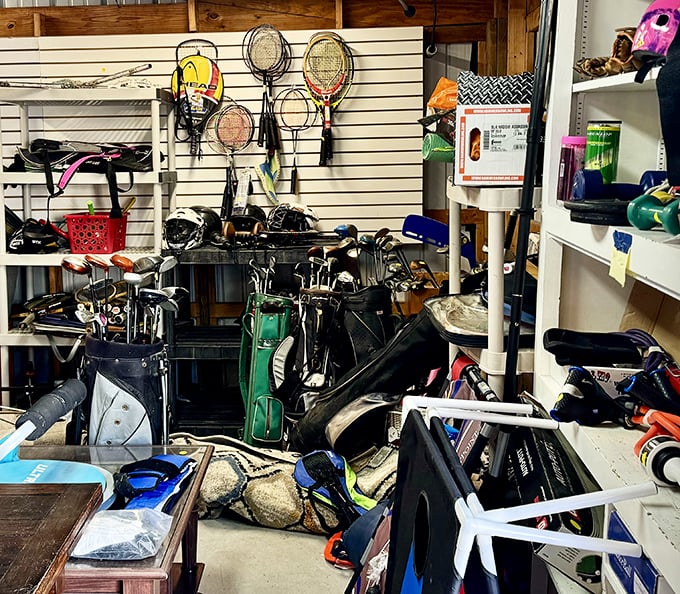 A sports equipment corner that's like a retirement community for golf clubs, where tennis rackets and fishing gear swap stories of glory days.
