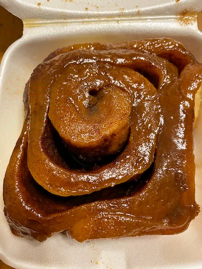 Behold the sticky bun in its natural habitat—glistening with caramelized glory. This isn't breakfast; it's an event.