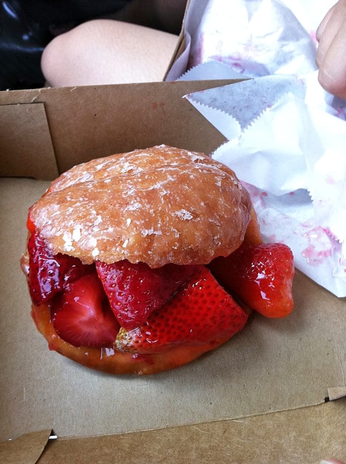 Behold the legendary strawberry donut in all its glory—a perfect marriage of fresh berries and glazed dough that's worth every mile of the journey.