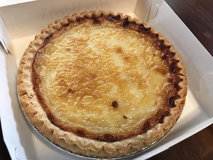The legendary sugar cream pie – Indiana's official state pie – glistening with sweet promise. One bite explains why people cross county lines.