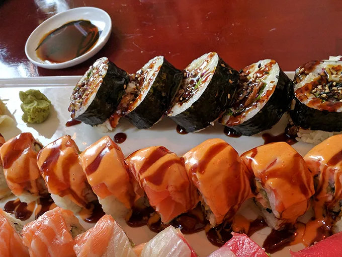 These aren't just sushi rolls; they're edible works of art. The vibrant colors and precise layering hint at the flavor explosion to come.