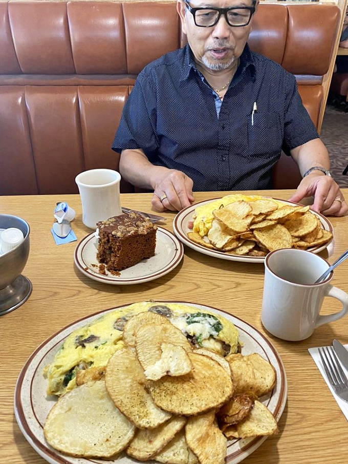 Breakfast platters that could double as weight training equipment – this spread with chocolate cake on the side is how champions start their day.