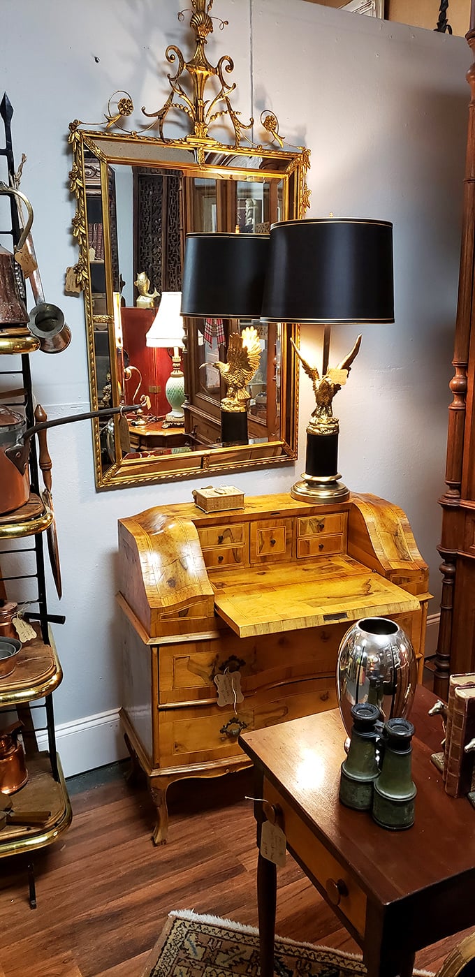 This isn't just furniture—it's a time machine with drawers. That eagle lamp looks ready to soar right off the desk with your credit card.