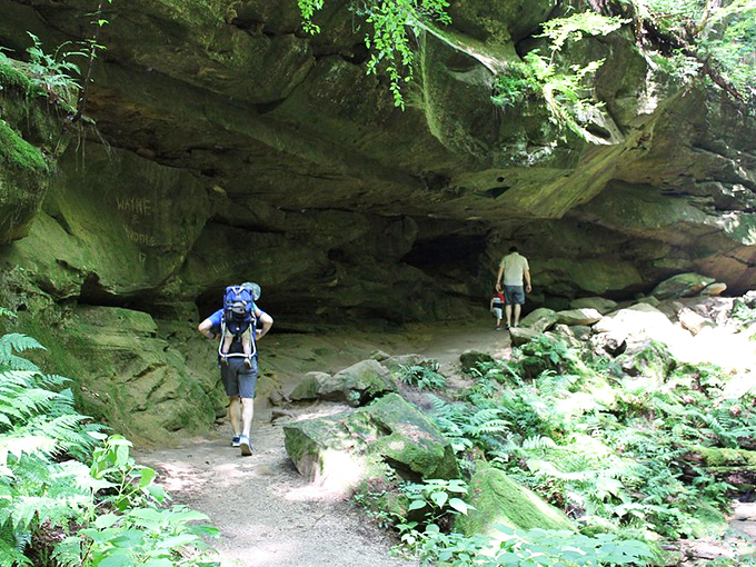 Hikers get that "honey, I shrunk the humans" feeling as they navigate beneath towering rock overhangs that have been perfecting their posture for millennia.