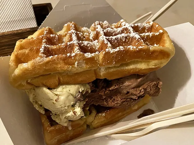 Behold the waffle sandwich—architecture's greatest contribution to dessert. Two golden waffles embracing ice cream like they've been separated for years.