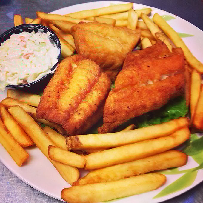 Golden-fried walleye that shatters with each bite, surrounded by crispy fries and creamy coleslaw—the holy trinity of fish house perfection.