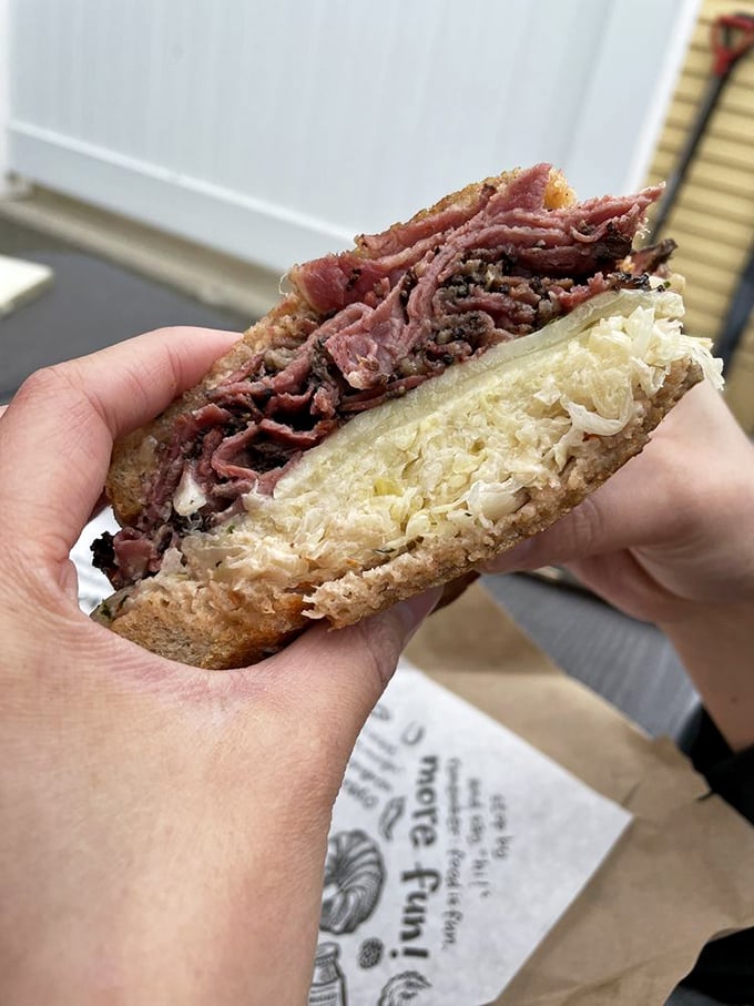 The legendary Reuben in all its glory—where corned beef, sauerkraut, Swiss cheese, and Russian dressing perform a perfectly choreographed dance between rye bread.
