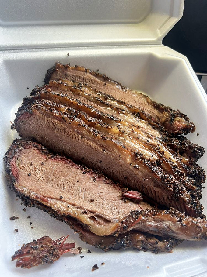 Behold the holy grail of brisket – that perfect pink smoke ring could make a vegetarian reconsider.