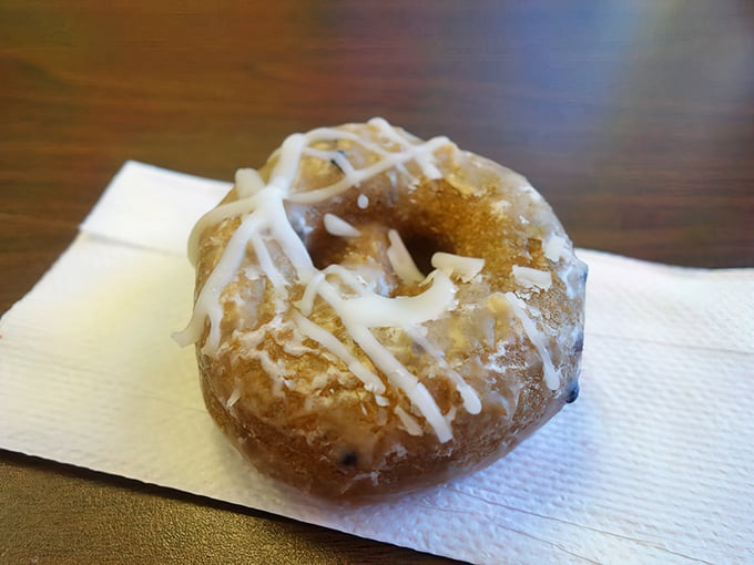 This isn't just a blueberry cake donut; it's edible architecture with personality. The drizzle isn't decoration—it's the signature on a masterpiece.