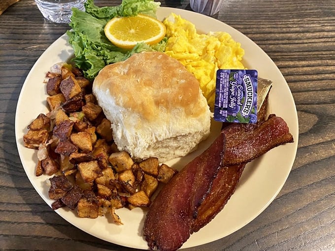 Breakfast perfection on a plate—golden hash browns, fluffy eggs, and bacon that would make even your cardiologist consider a cheat day.