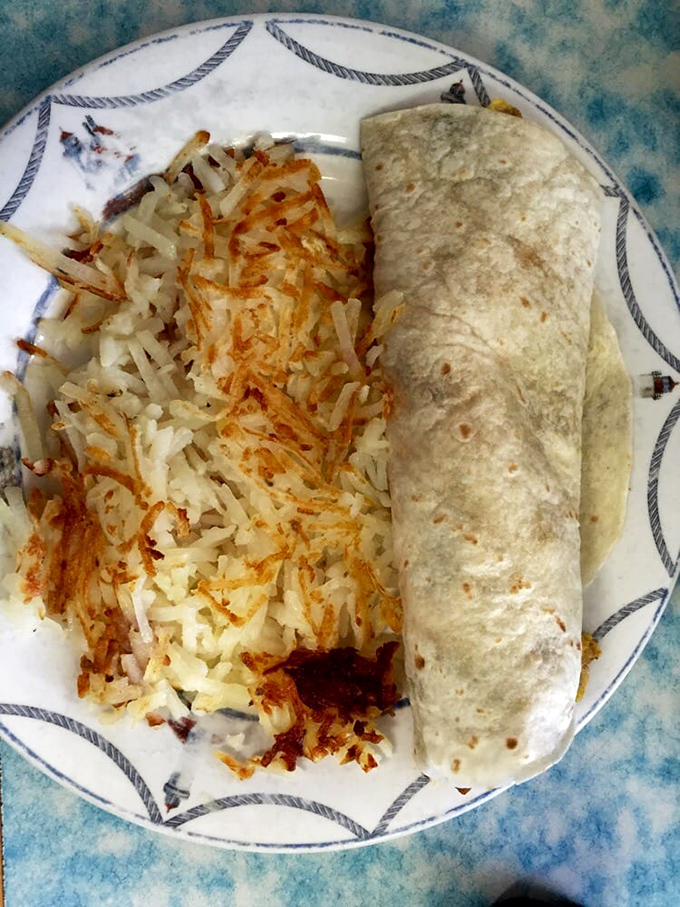 This breakfast burrito with perfectly crisped hashbrowns isn't just a meal—it's morning salvation wrapped in a tortilla. Worth getting out of bed for.
