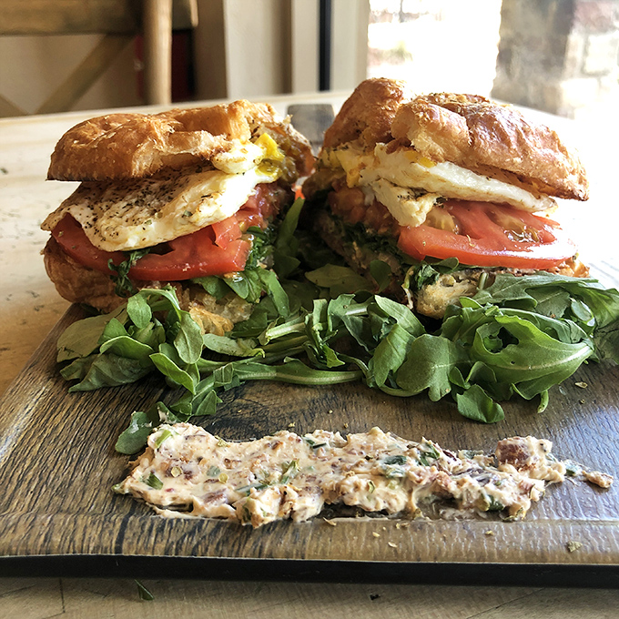 Breakfast architecture at its finest—layers of flavor stacked higher than Florida's humidity. This sandwich demands both hands and your full attention.