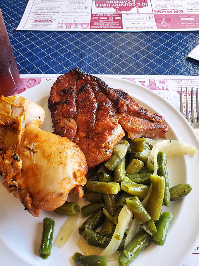 Country cooking doesn't get more honest than this—a plate where pork meets green beans with no fancy introductions, just pure heartland flavor.