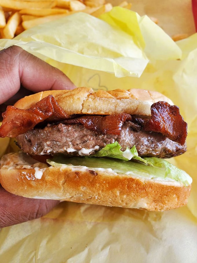 Behold the bacon burger in all its glory—a juicy patty crowned with crispy bacon that's been kissed by the grill gods themselves.