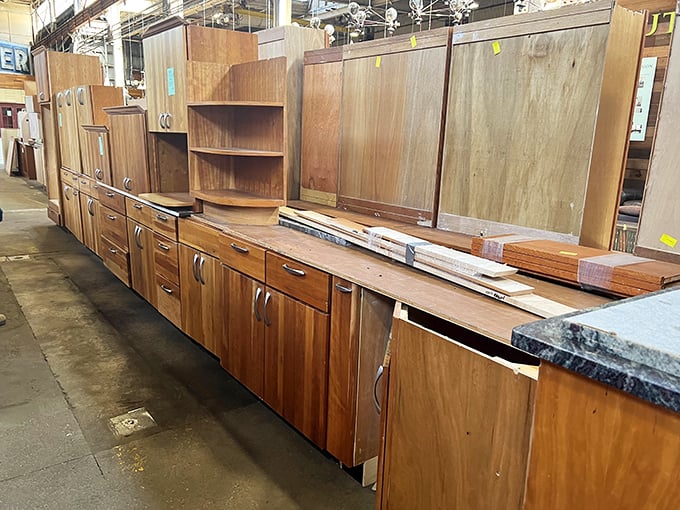 Kitchen cabinet heaven stretches as far as the eye can see—each wooden door holding potential for your next renovation revelation.