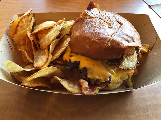Not all heroes wear capes—some come in cardboard boxes with house-made chips. This burger demands a moment of silent appreciation.