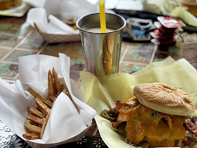 This isn't just lunch; it's a symphony of flavors where hand-cut fries and a cheese-draped burger perform in perfect harmony.