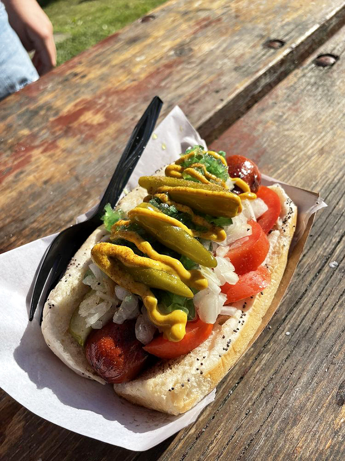 This Chicago Dog isn't just lunch—it's architecture. A skyscraper of toppings perfectly balanced on an Angus beef foundation.
