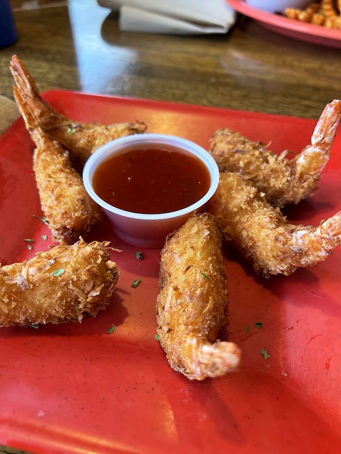 Golden coconut shrimp perfection that makes Red Lobster look like amateur hour - crispy, sweet, absolutely divine.