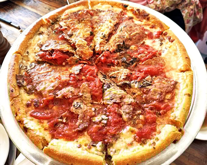 This isn't just pizza—it's architecture. Layers of cheese, sauce, and toppings creating a skyscraper of flavor that would make Frank Lloyd Wright proud.