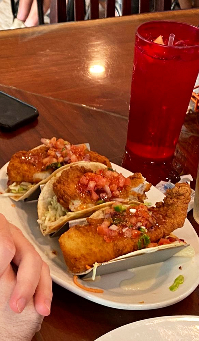 These aren't just fish tacos; they're an edible love letter to the Gulf. Crispy fish, fresh pico de gallo, and that sauce—oh, that sauce!