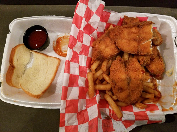 Golden-brown fried catfish nestled beside crispy fries and white bread—a Chicago trinity that makes taste buds stand up and applaud.