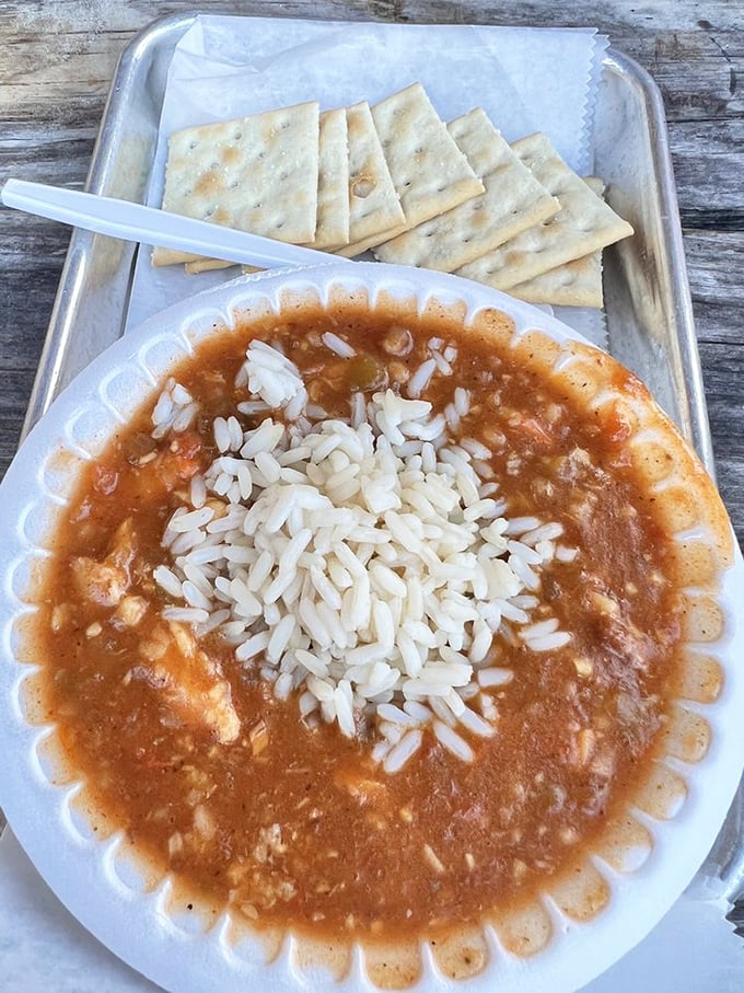 This isn't just gumbo – it's a warm Gulf hug in a bowl. That rice island floating in seafood-rich waters tells you everything about priorities here.