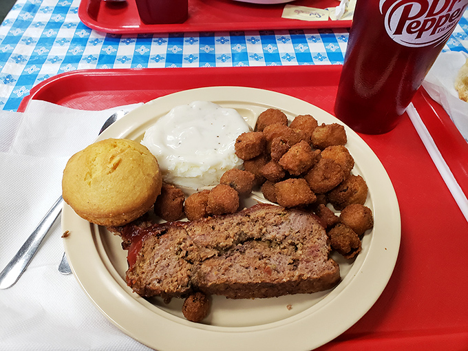 This isn't just meatloaf—it's edible nostalgia on a plate, complete with cornbread and okra that would make your grandmother both proud and jealous.