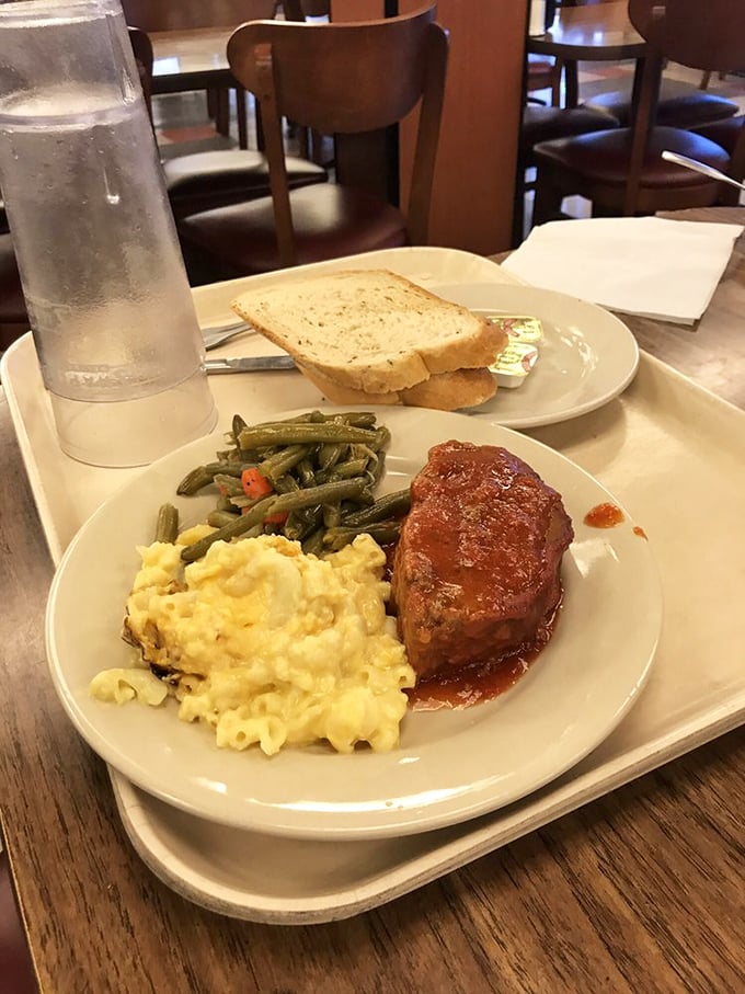 This isn't just meatloaf; it's a masterpiece of Midwestern comfort—tender, savory, and paired with creamy mac and cheese that could make a grown adult weep with joy.