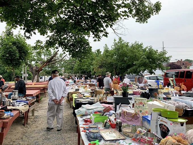 Under the watchful shade of mature trees, tables laden with possibilities await—each one a tiny museum of American life from decades past.