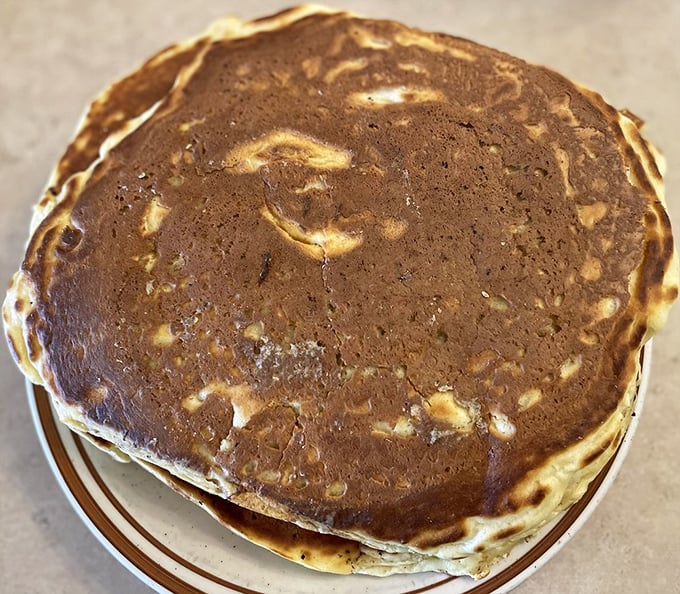 These golden-brown pancakes aren't just breakfast—they're edible works of art with perfectly crisp edges that would make Rembrandt jealous.