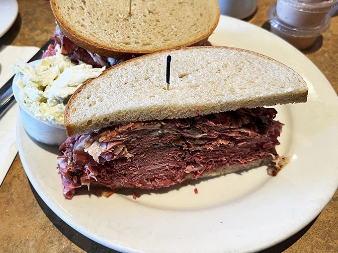 Behold the pastrami sandwich in its natural habitat – stacked higher than your cardiologist would recommend, but worth every delicious bite.