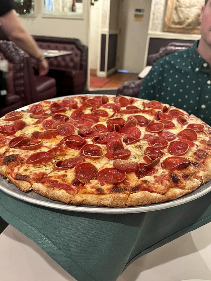 This isn't just pepperoni pizza—it's a masterclass in perfection. Those curled-up edges creating little cups of savory goodness might just bring a tear to your eye.