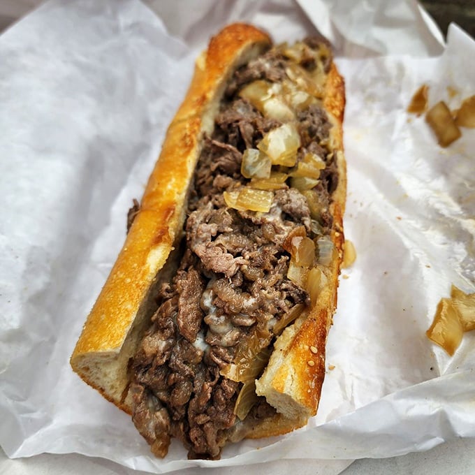 The holy grail of Philadelphia sandwiches. Perfectly chopped ribeye, caramelized onions, and melted cheese nestled in that legendary house-baked roll—worth every minute in line.