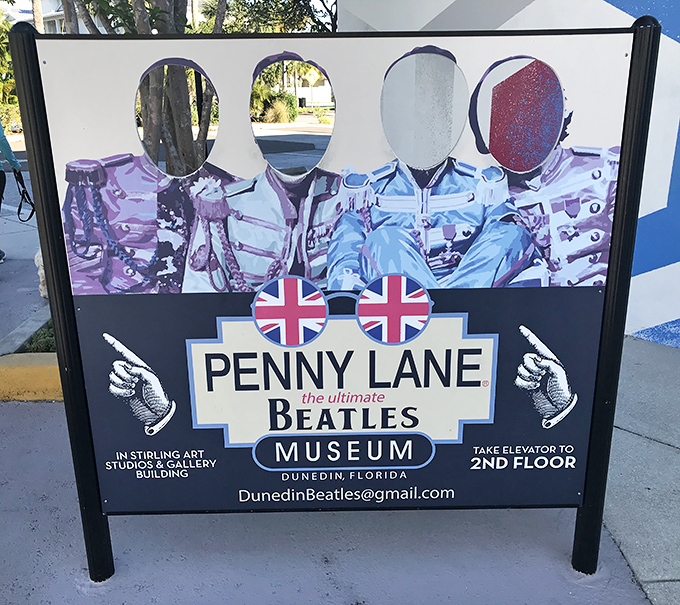 Come together, right now—over this photo op! The sidewalk sign invites passersby to become the fifth Beatle, if only for a snapshot moment.