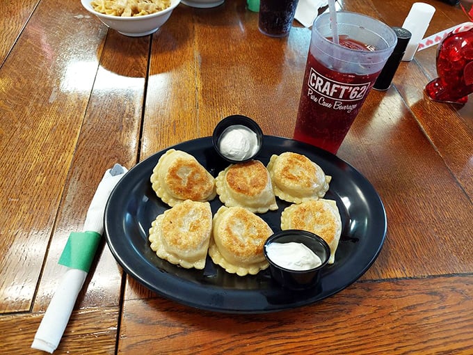 Golden-brown pockets of joy, perfectly sautéed and served with the holy trinity of pierogi accompaniments: sour cream, more sour cream, and did I mention sour cream?