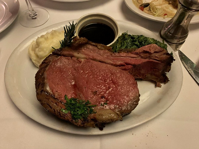 Behold the prime rib in all its glory – a magnificent roast that could make vegetarians question their life choices.
