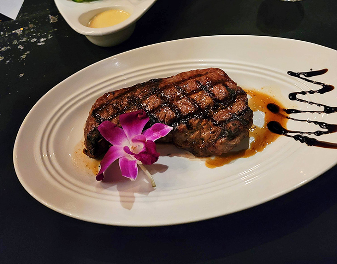 Perfectly cross-hatched grill marks that would make a geometry teacher proud. This steak doesn't need Instagram filters—it's already dressed for success.