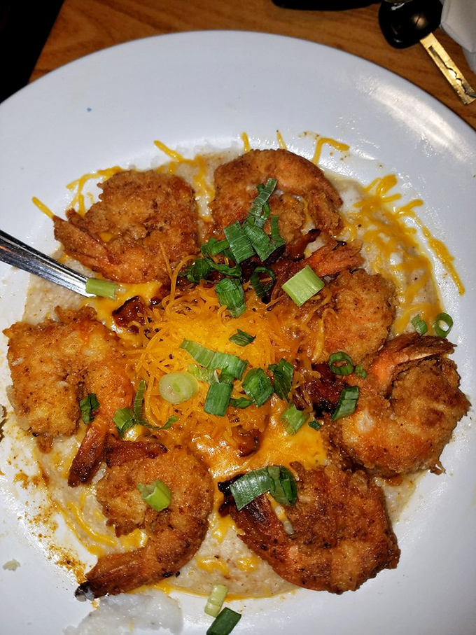 These shrimp and grits aren't just a dish—they're a Southern hug on a plate, with each golden morsel surrounded by cheesy goodness that would make even a grits skeptic swoon.