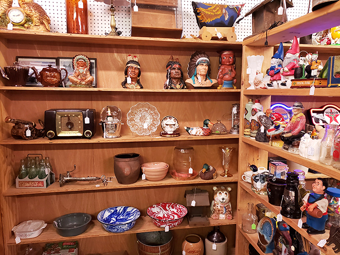 Native American figurines sharing shelf space with vintage kitchenware – where cultural history and domestic nostalgia create unexpected harmony.