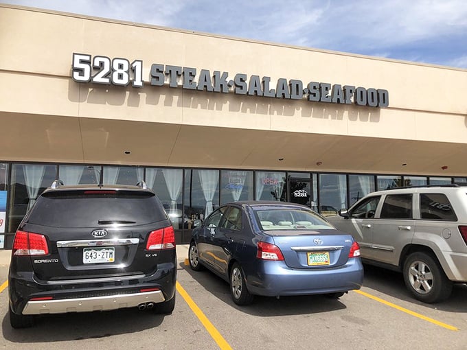 Don't let the strip mall location fool you – inside this unassuming spot, steak magic happens at exactly 5,281 feet above sea level.