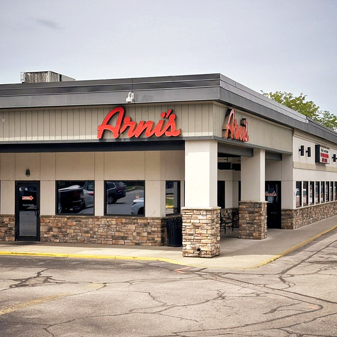 Arni's red sign glows like a beacon for hungry travelers—the pizza equivalent of the North Star for those navigating Indiana's culinary landscape.